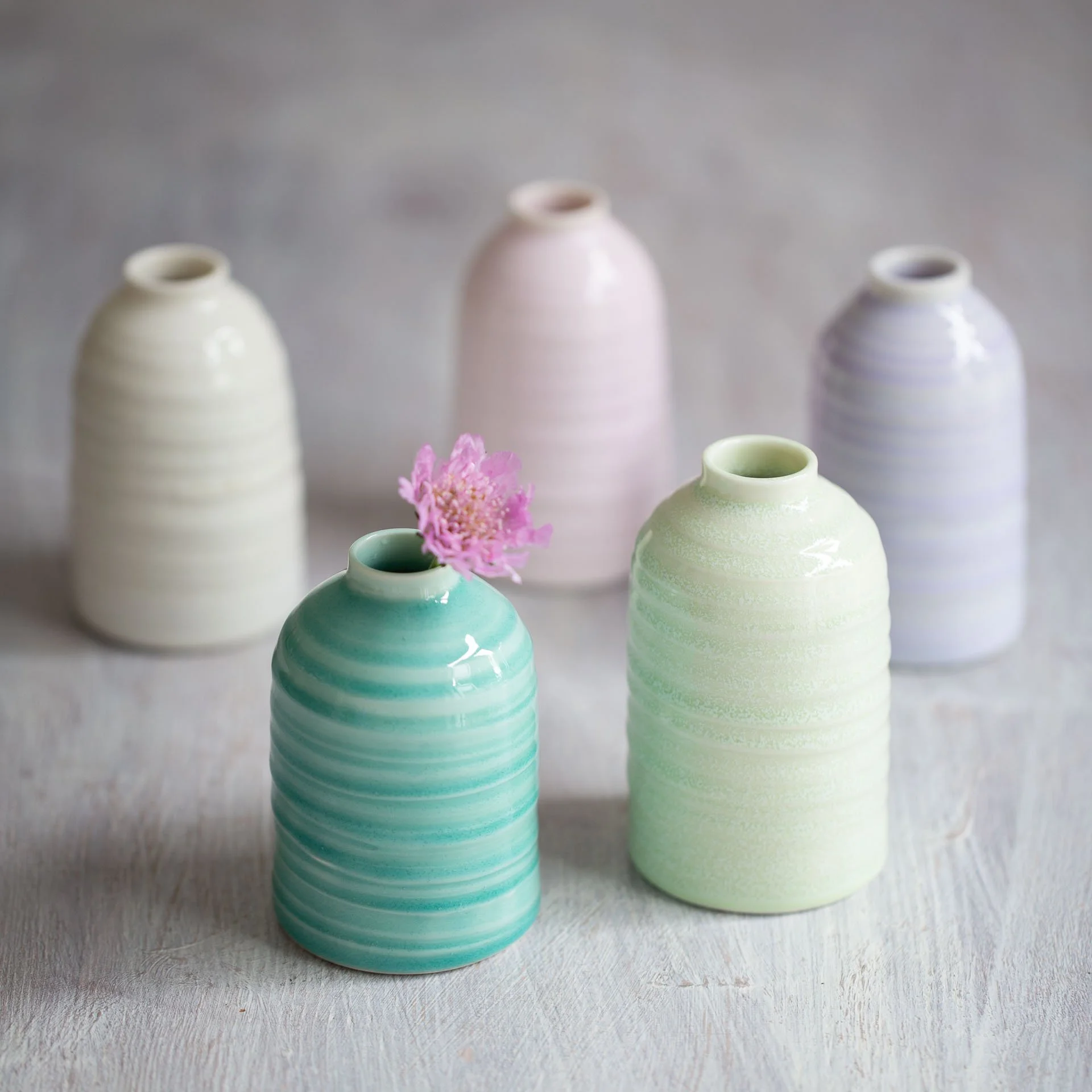 Beautiful hand-thrown ceramic vessels in porcelain clay with colours ...