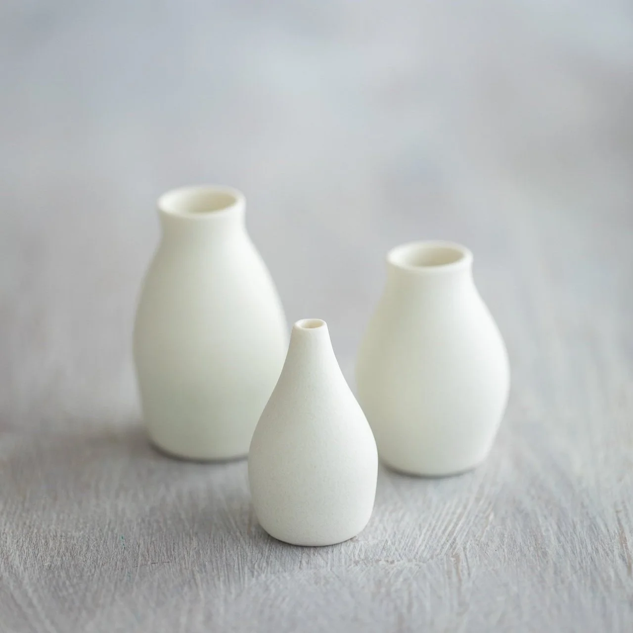 Beautiful hand-thrown ceramic vessels in porcelain clay with colours ...
