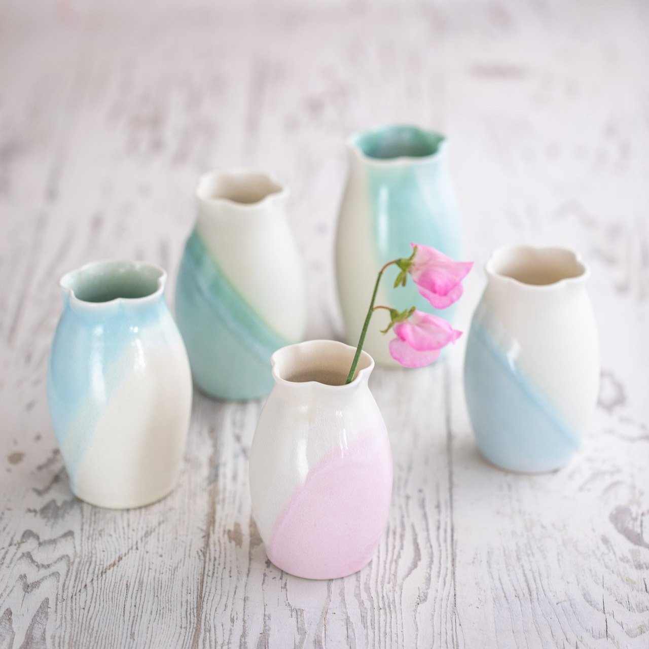 Beautiful hand-thrown ceramic vessels in porcelain clay with colours ...
