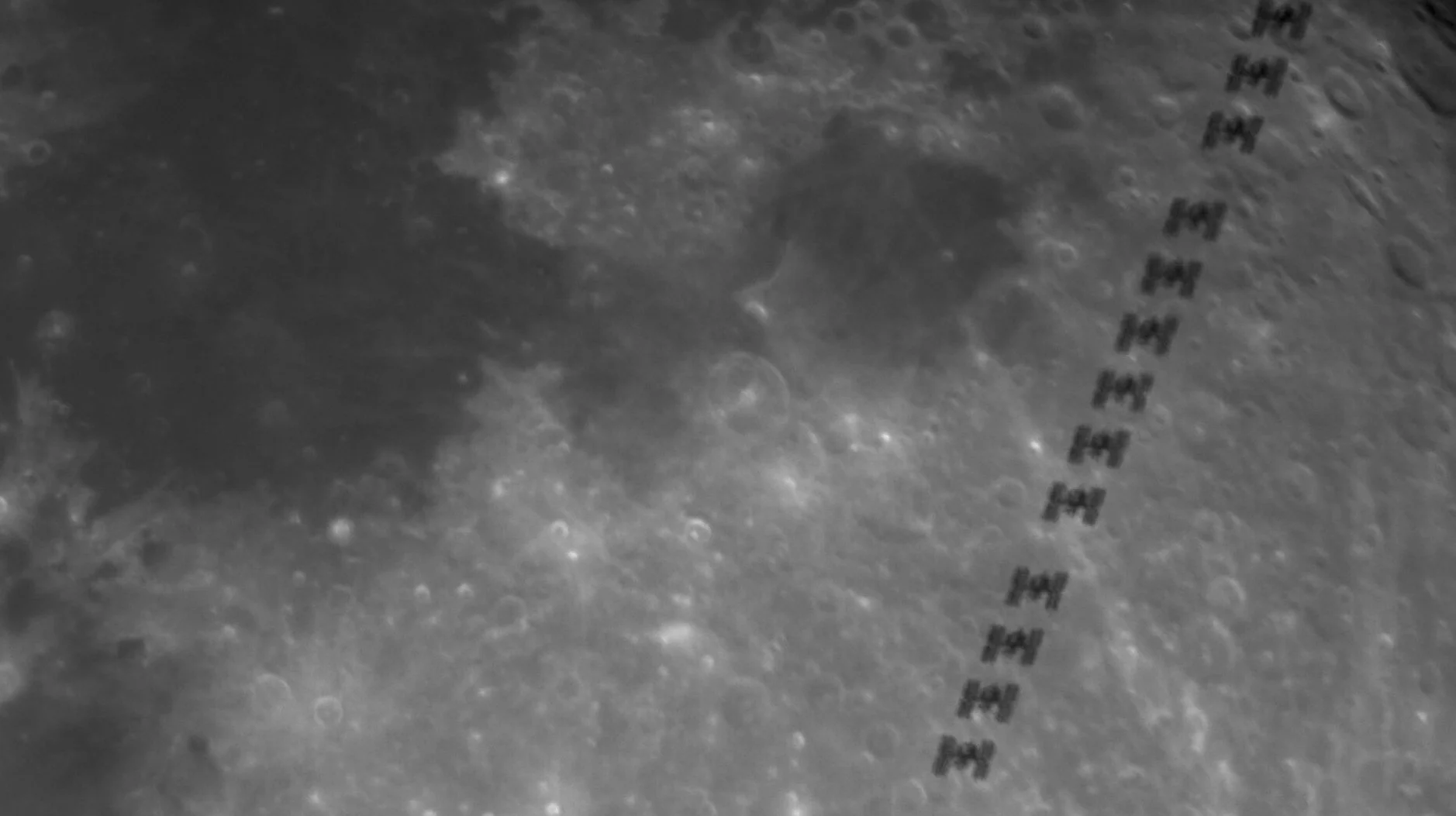 The ISS Crossing In Front of a Nearly Full Moon — Stephen Mack