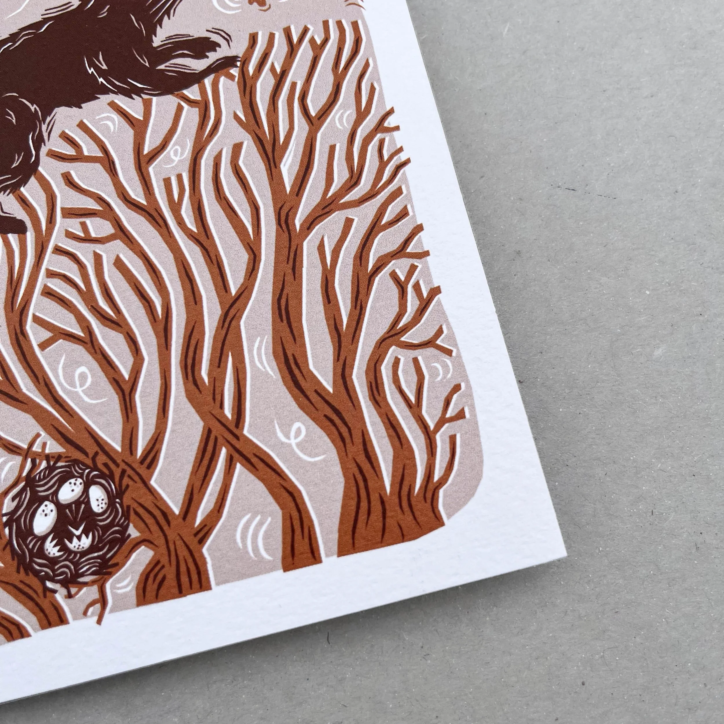 A seasonal greetings card featuring a squirrel playing amongst the tree ...