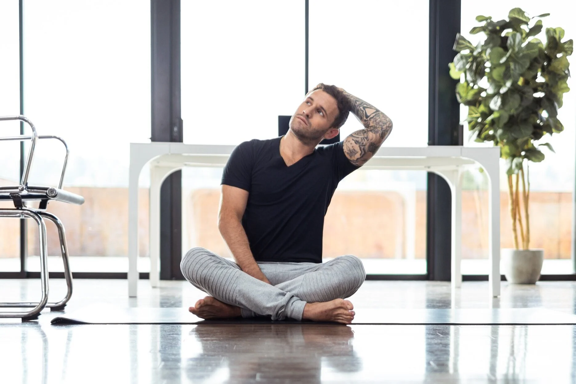 8 Yoga Poses You Can Do At Your Desk — Alo Wellness Club | The Blog