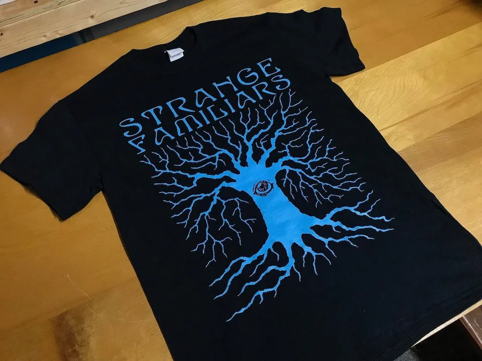MERCH — Strange Familiars