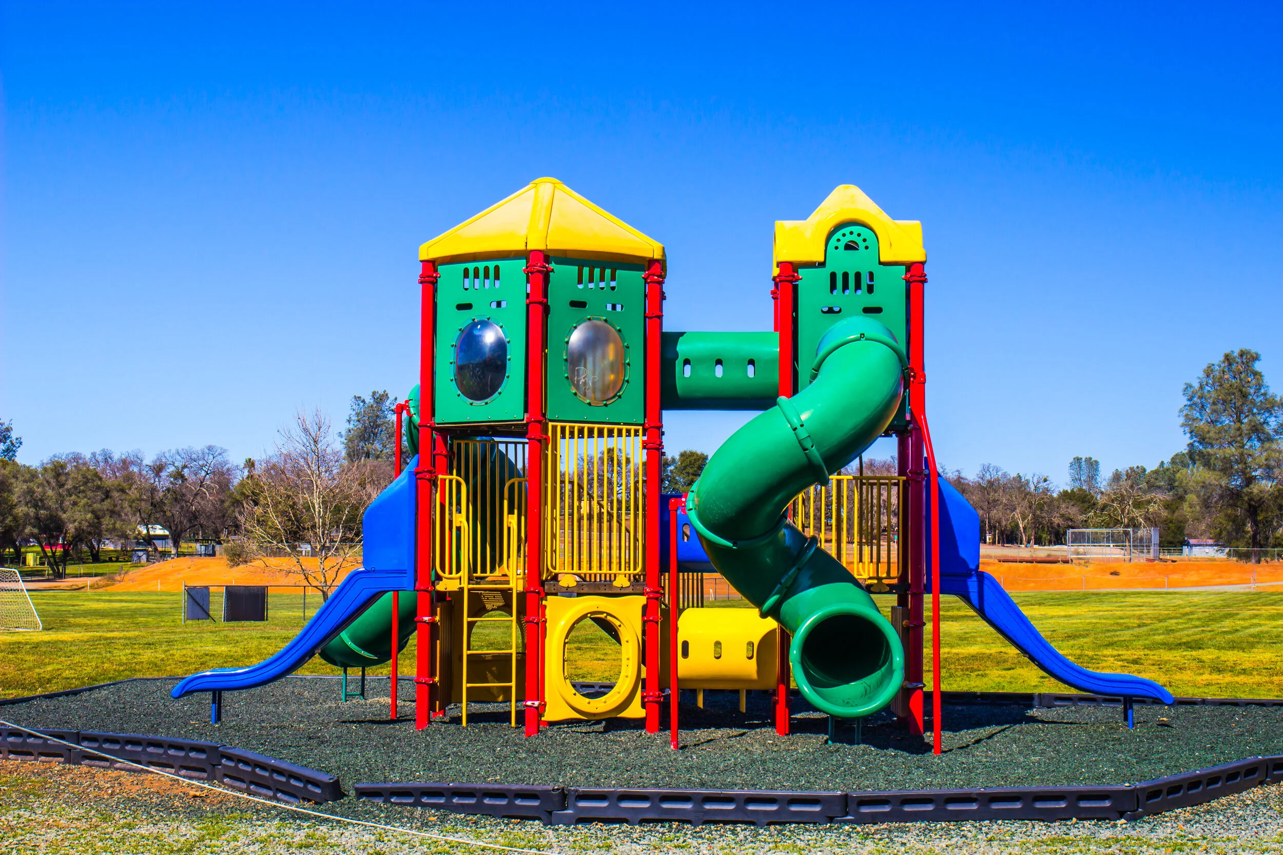 Best Playground Surfaces: Rubber Vs. Natural — Build With a Bang