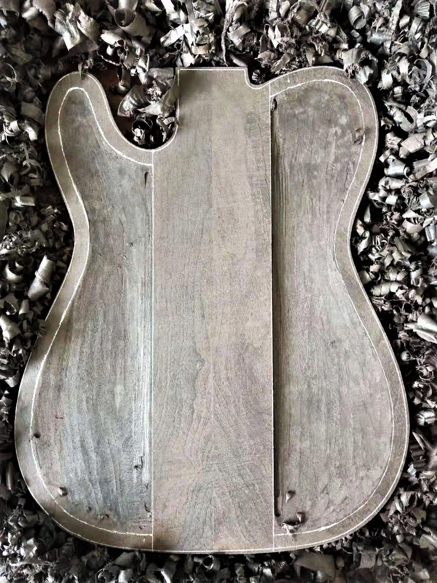 Blog: Hand carving a semi-acoustic guitar from 7500-year-old sinker ...