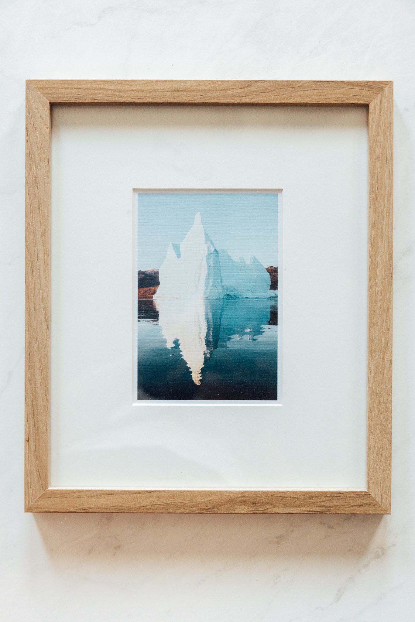 Frozen Majesty Framed: A Ship Porthole View of an Arctic Iceberg — The ...