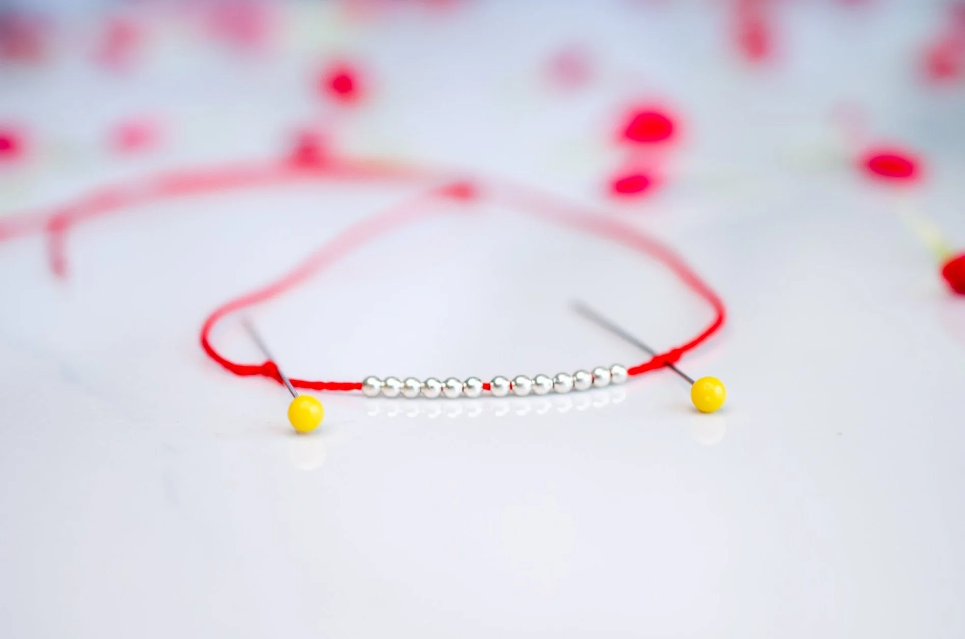 DIY: Red thread bracelets with seed beads — Our Happy Tribe
