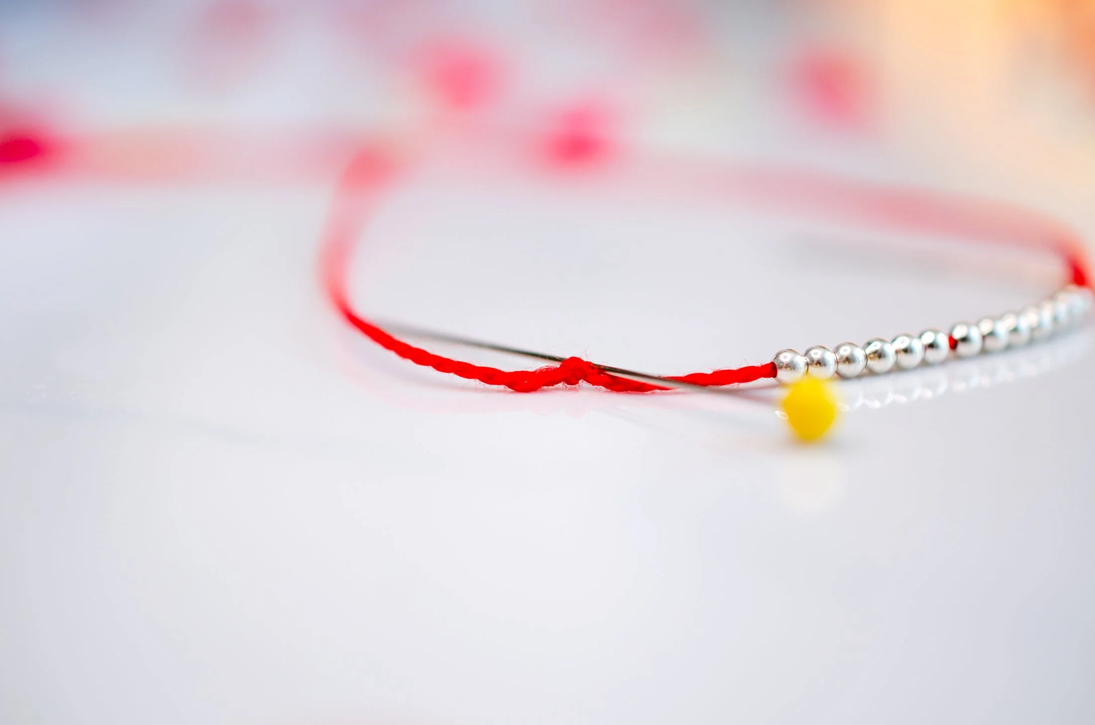 DIY: Red thread bracelets with seed beads — Our Happy Tribe