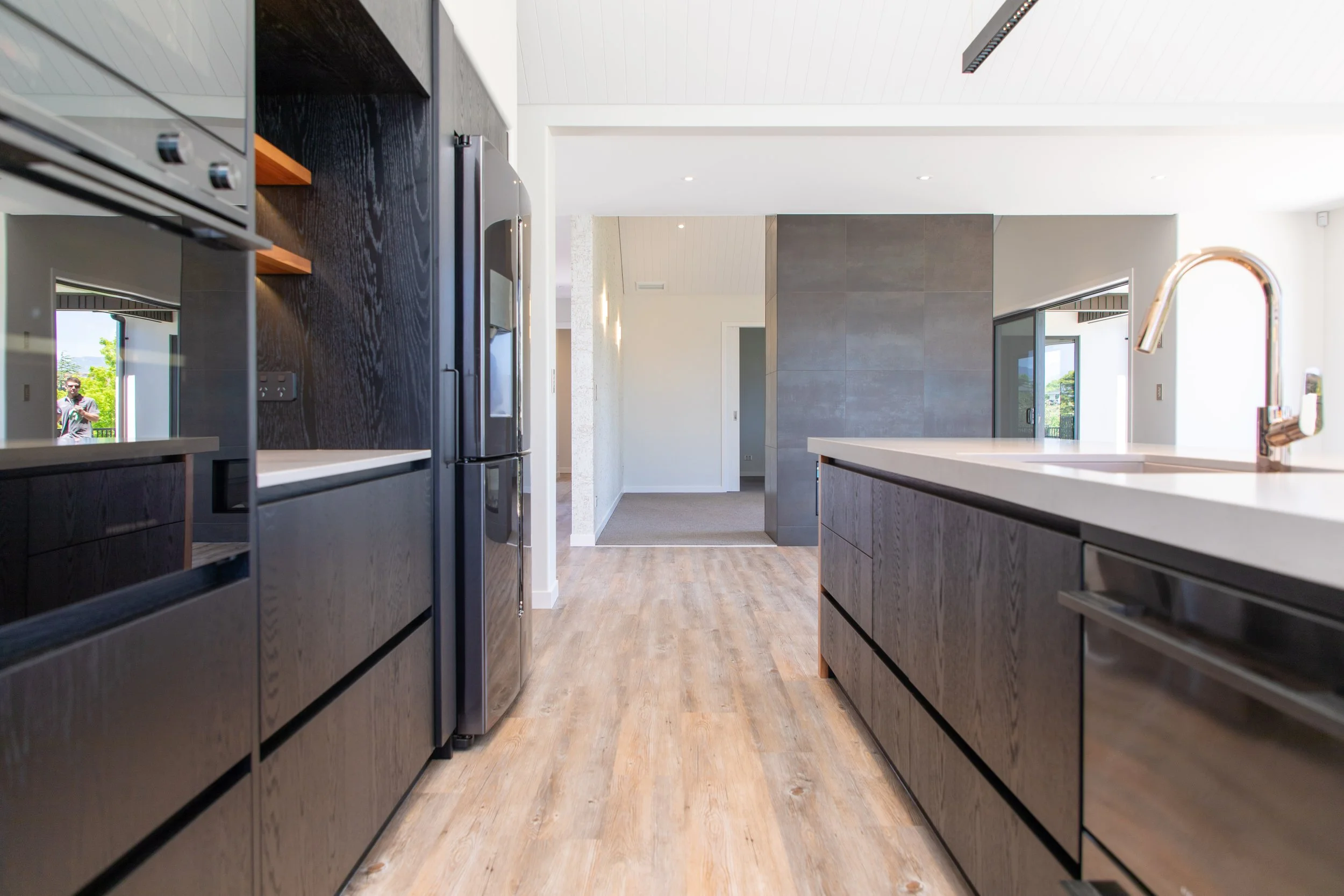 NZ Native Rimu battens and shelves complement this raw concrete ...