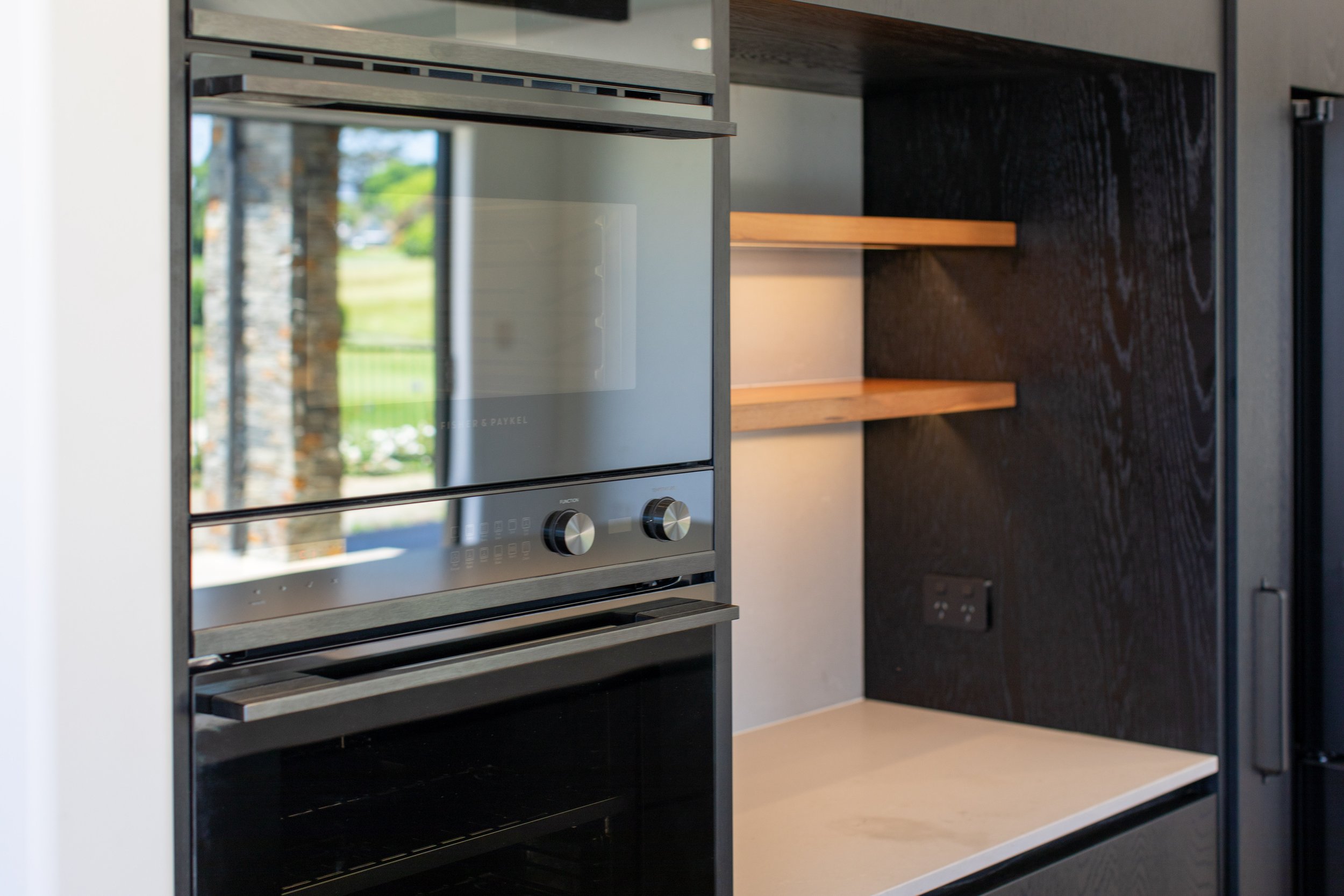 NZ Native Rimu battens and shelves complement this raw concrete ...