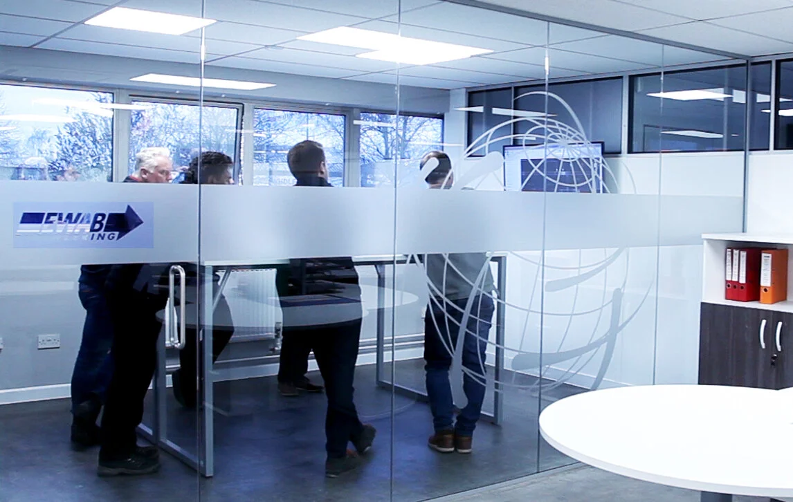 We design and build — EWAB Conveyor Automation Systems