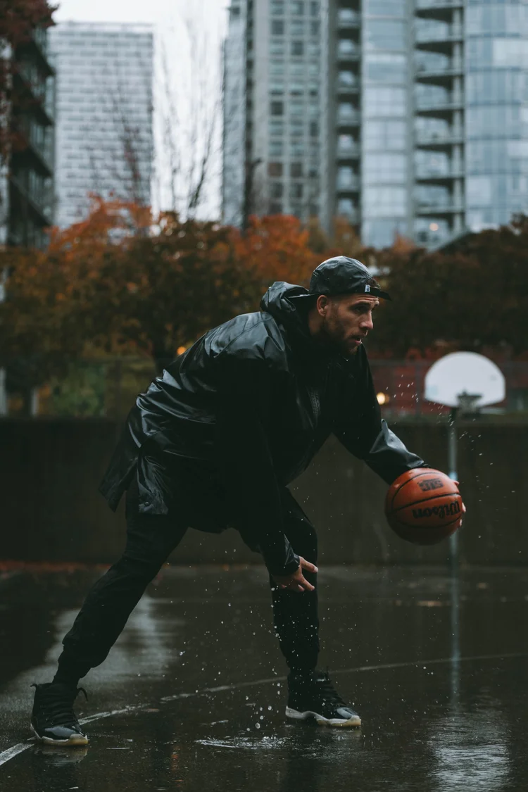 Basketball in the rain with San poncho — Moments of Wild