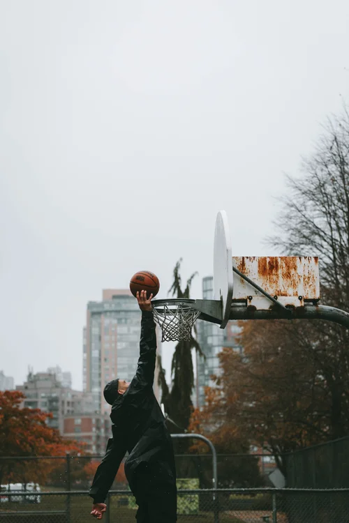 Basketball in the rain with San poncho — Moments of Wild