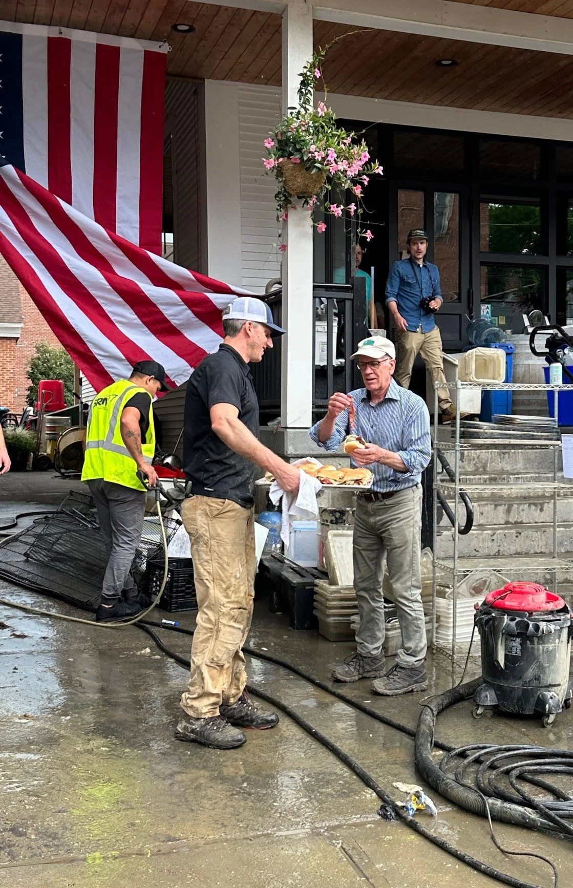 Welch tours flood zone amidst mud, cleanup, free lunch, socks, music ...