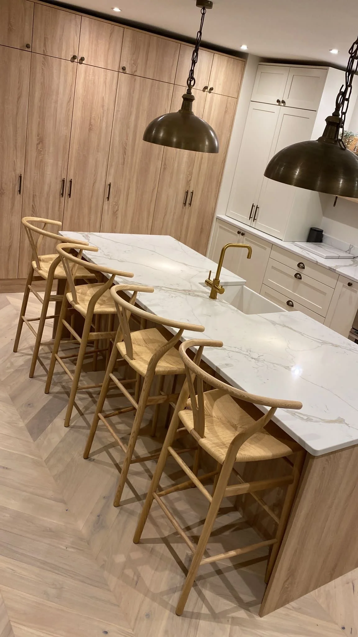 Stylish curved bar stool with brass finish trim | Eaton and Boru