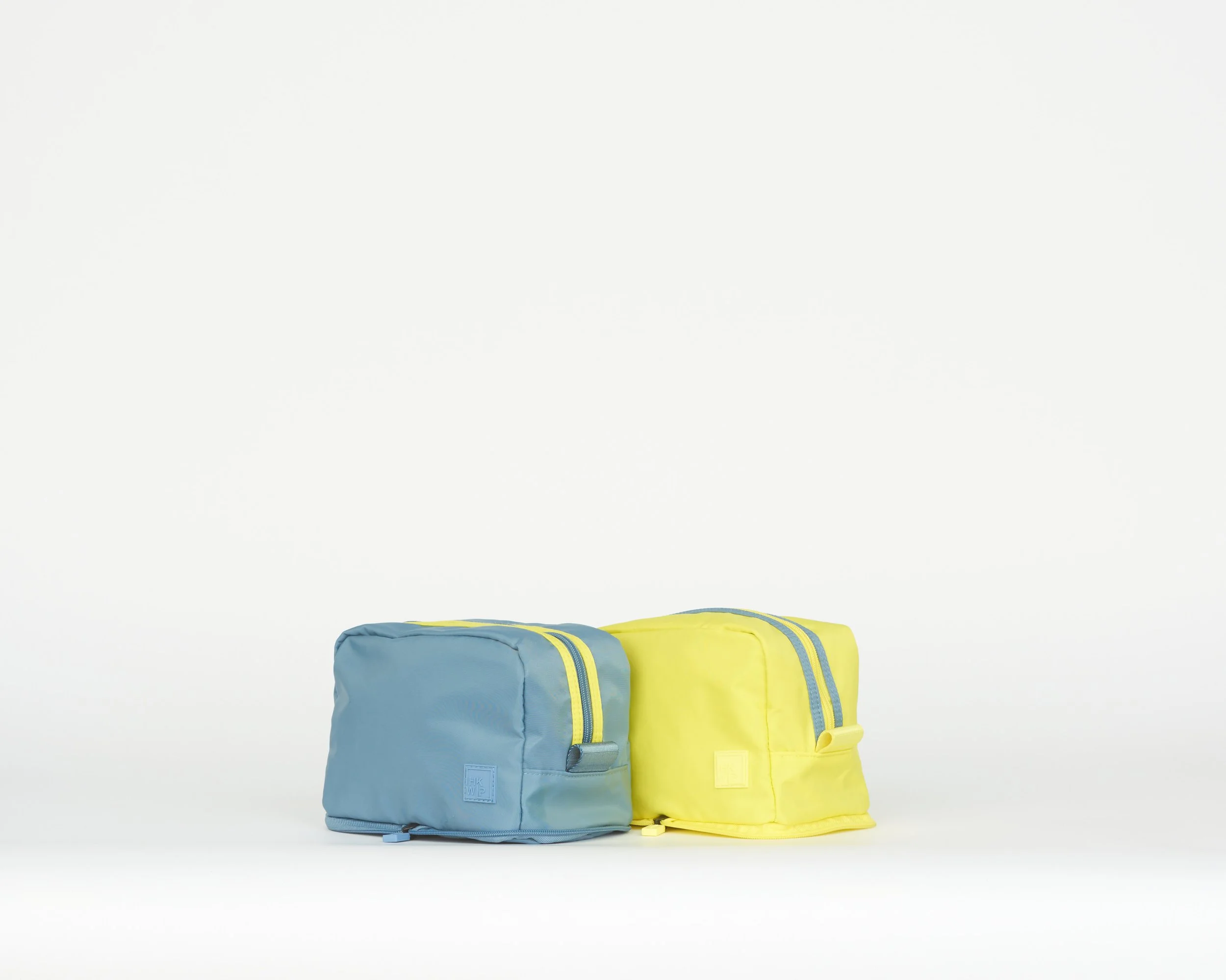 THE SET OF 2 PACKABLE COSMETIC CASES - FADED INDIGO/LIGHTNING YELLOW ...