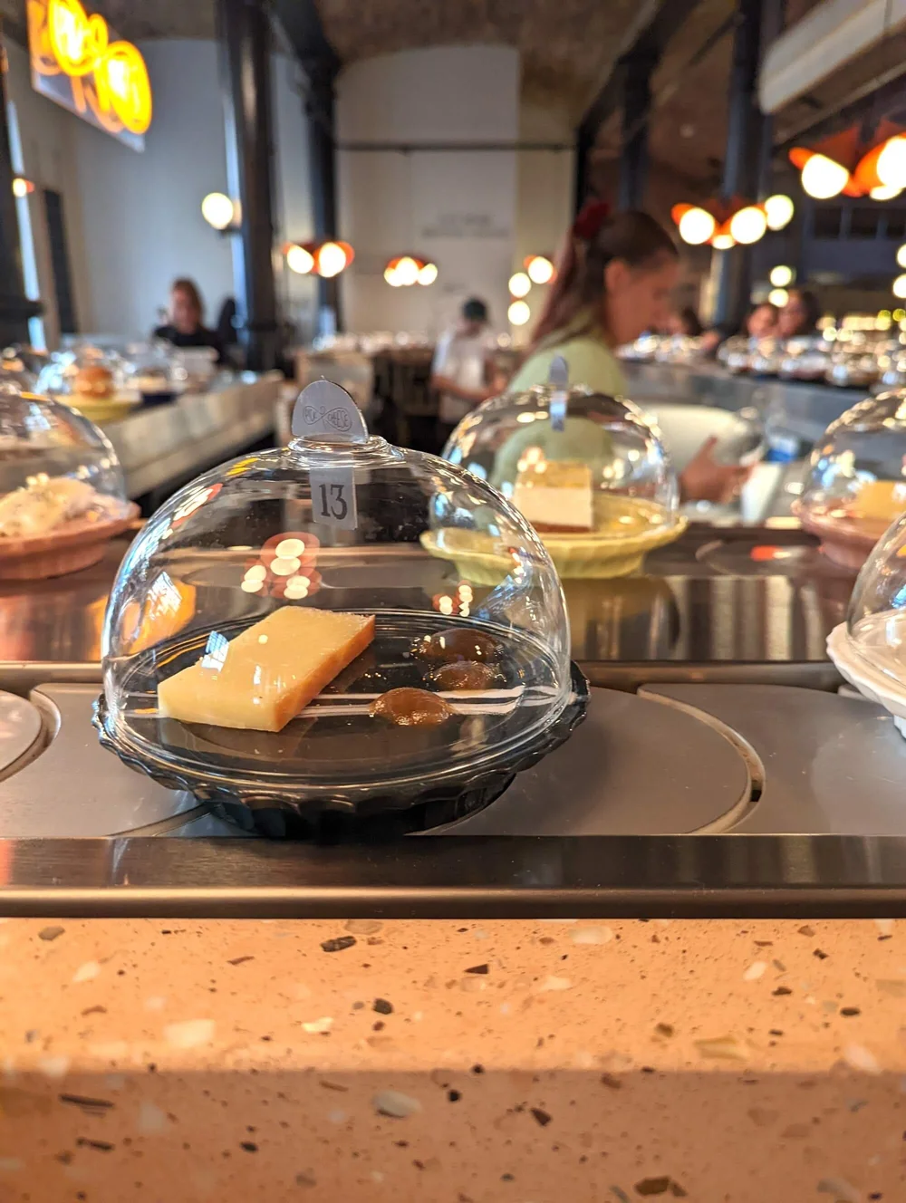 How A Visit to the World’s First Cheese Conveyor Belt Restaurant ...