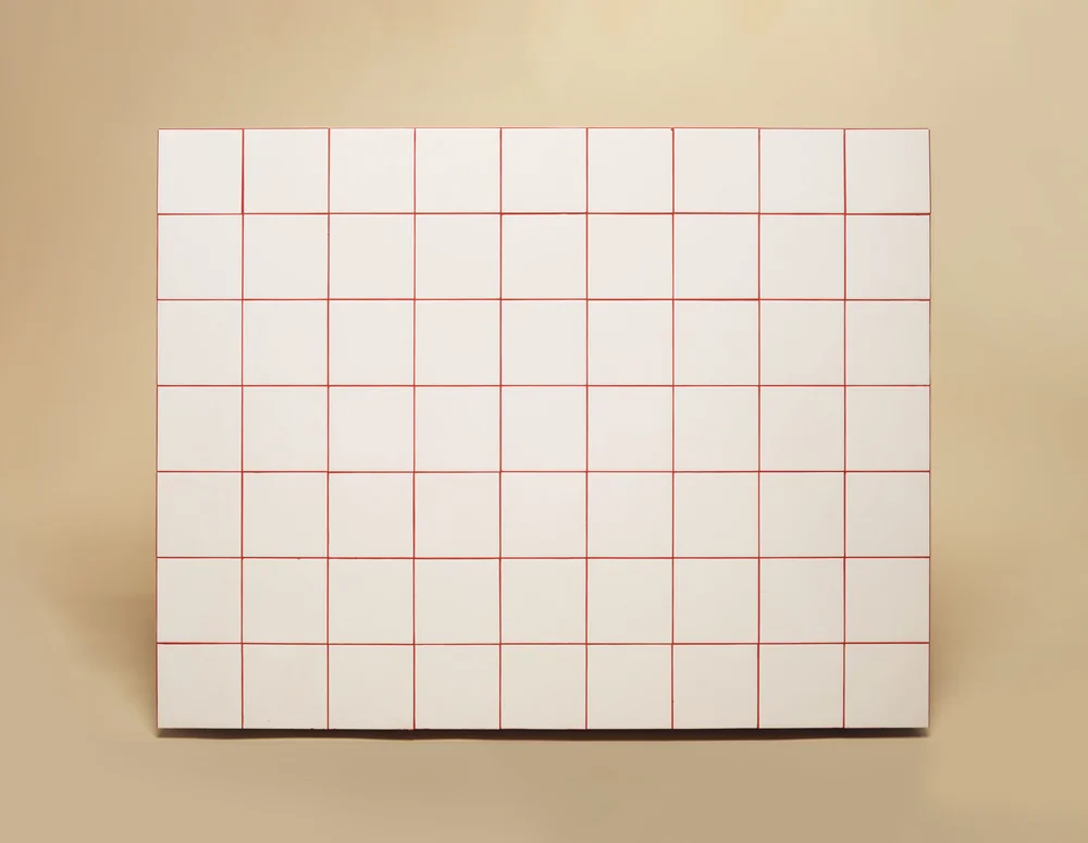 Club Tile, a chair gridded in tile and bold grout. — Foreign National