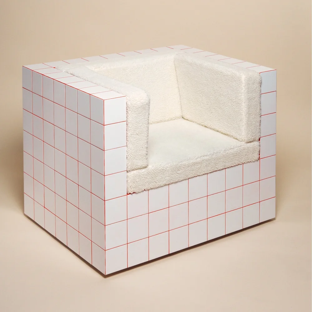 Club Tile, a chair gridded in tile and bold grout. — Foreign National