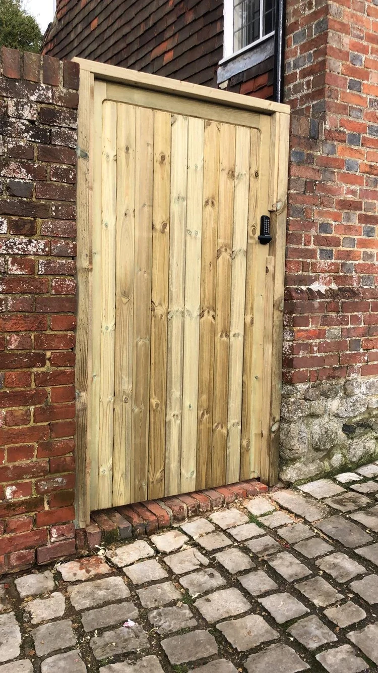 Secure gate with keypad entry for side pedestrian access to the garden ...
