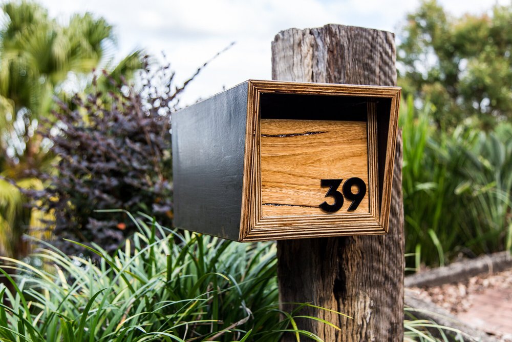 Custom designed letterbox using reclaimed railway sleeper and plywood ...