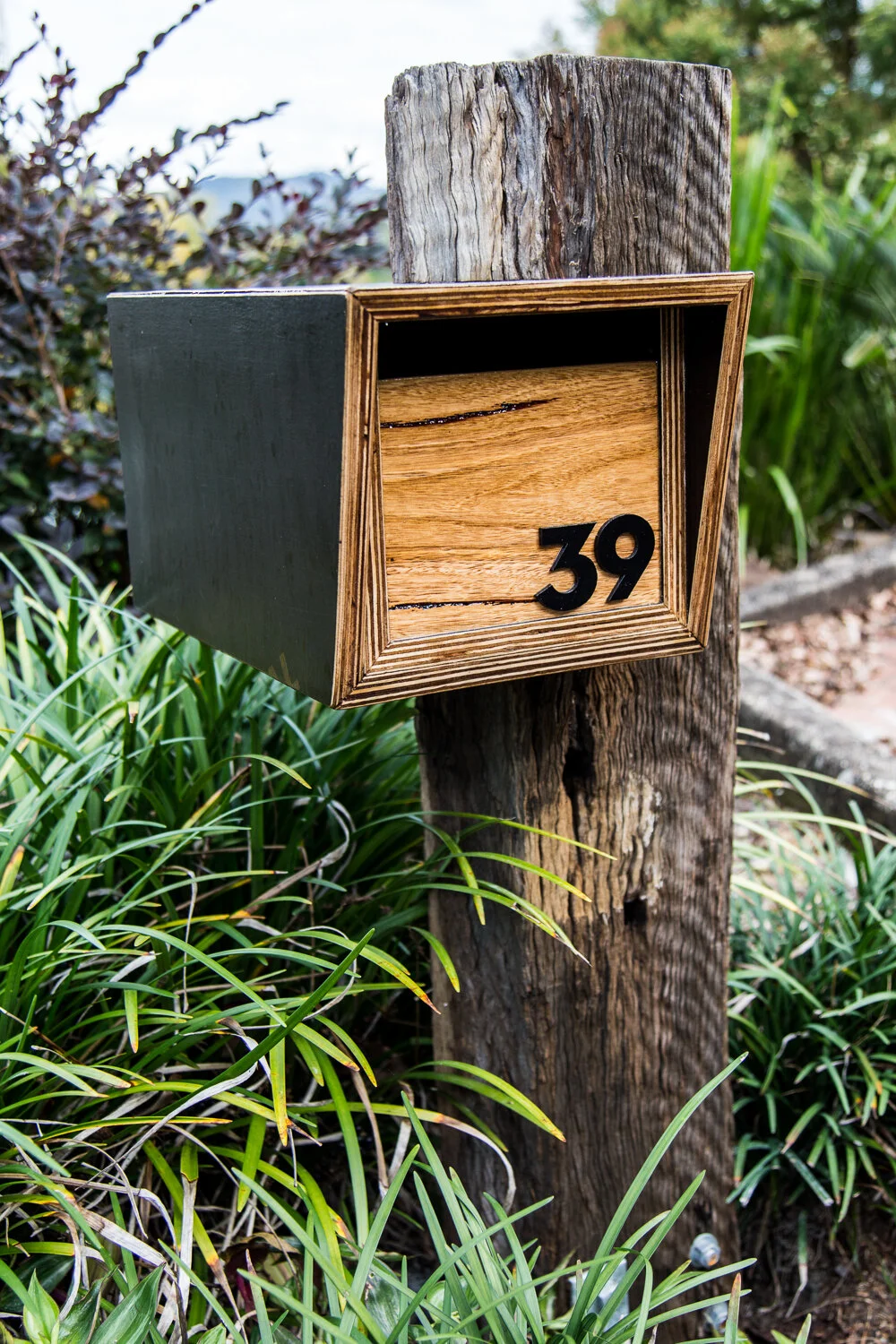 Custom designed letterbox using reclaimed railway sleeper and plywood ...