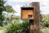 Custom designed letterbox using reclaimed railway sleeper and plywood ...