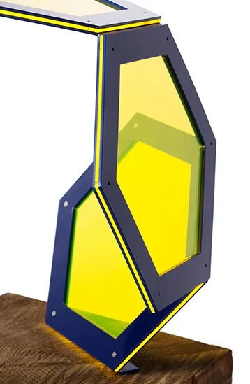 Yellow Glowing Hexagonal Indoor Sculpture Set On A Natural Wood Base ...