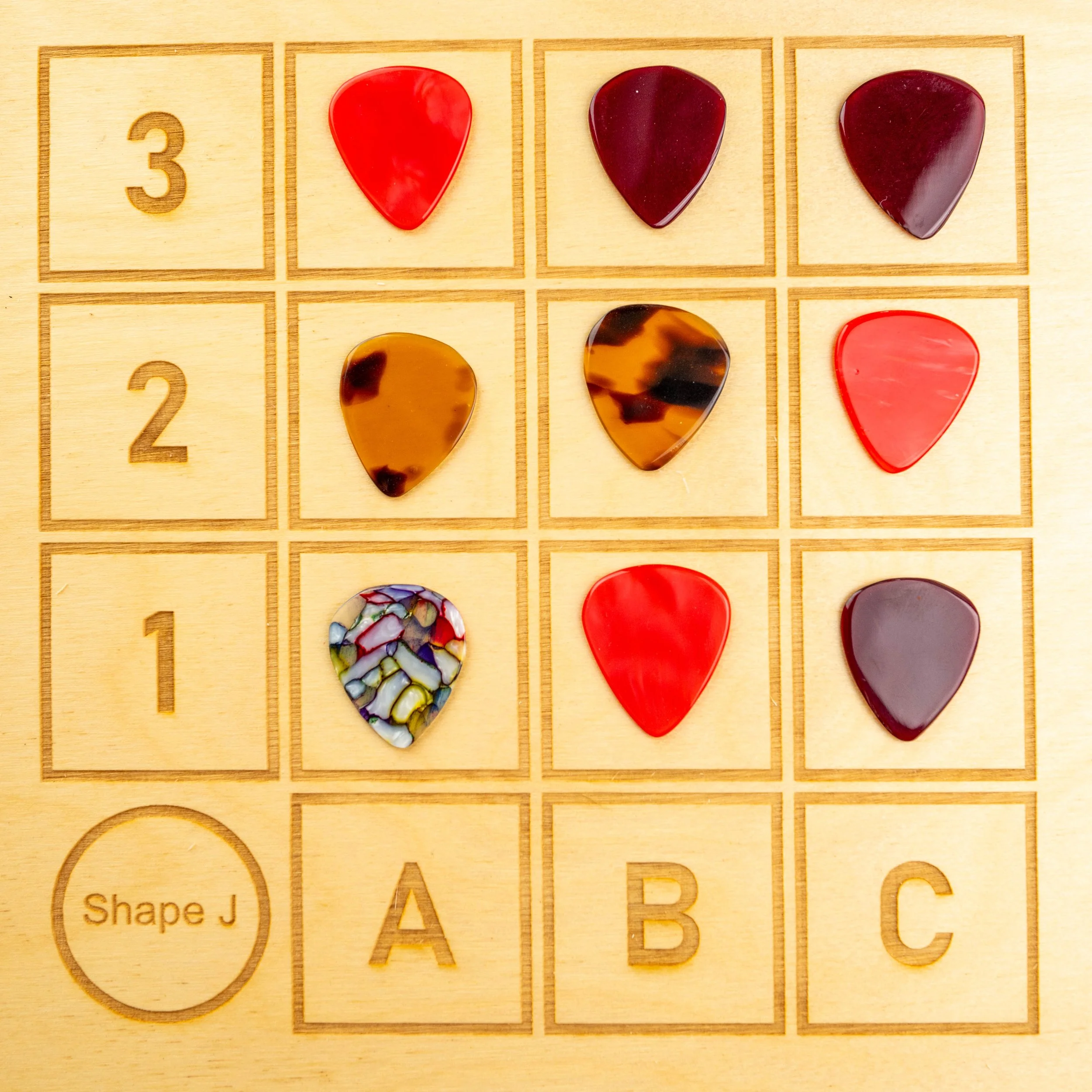 Shape J — Apollo Picks | Custom Made. Casein and PEEK.