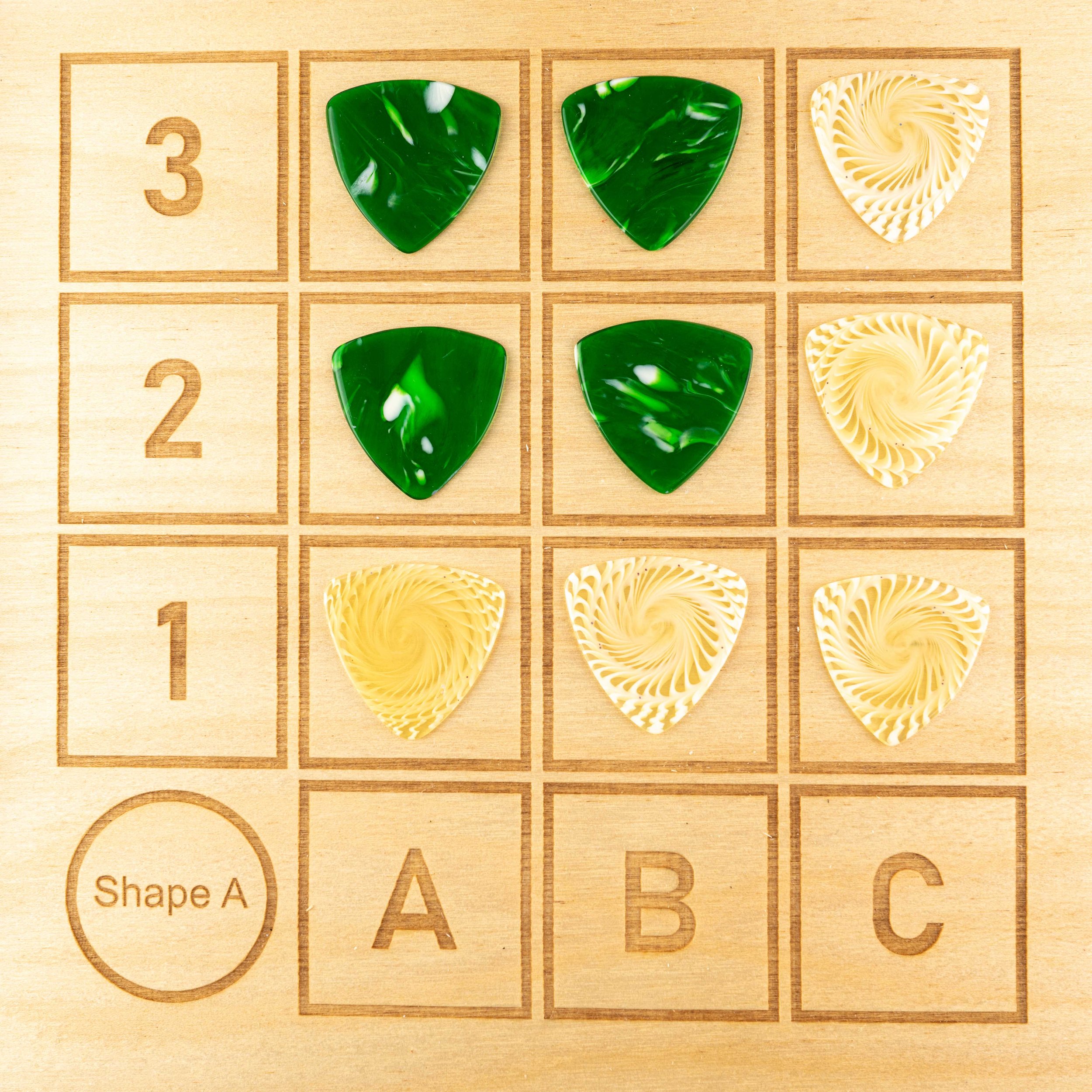 Shape A — Apollo Picks | Custom Made. Casein and PEEK.