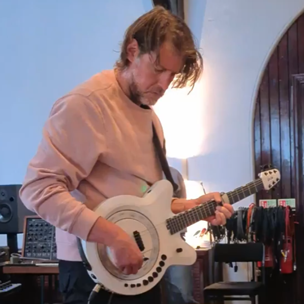 Circle Guitar is an electro-mechanical guitar that uses a MIDI-enabled ...