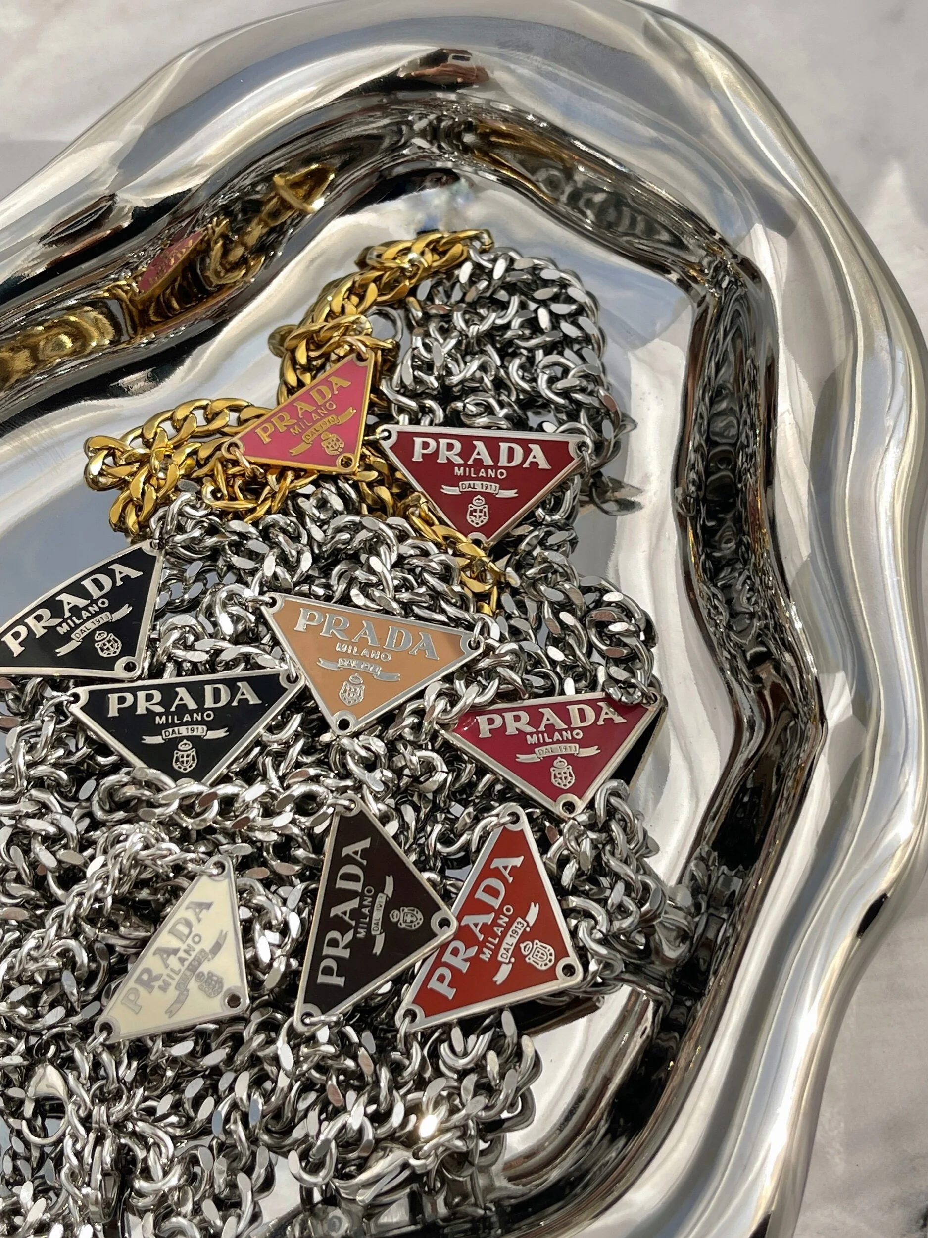 Prada Triangle Logo Collection — Shop — LUXE Reworked