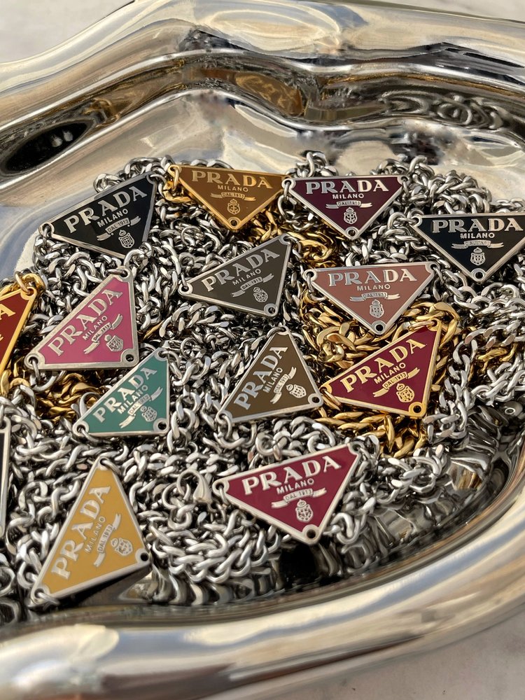 Prada Triangle Logo Collection — Shop — LUXE Reworked