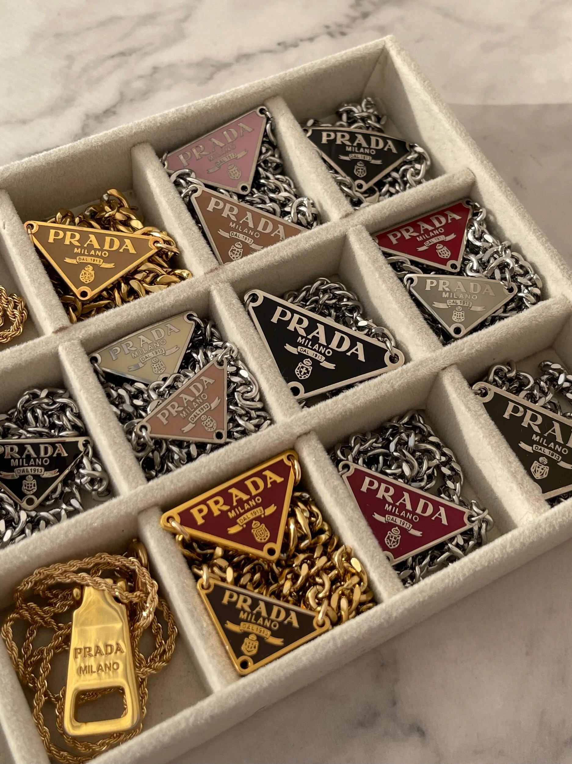 Prada Triangle Logo Collection — Shop — LUXE Reworked