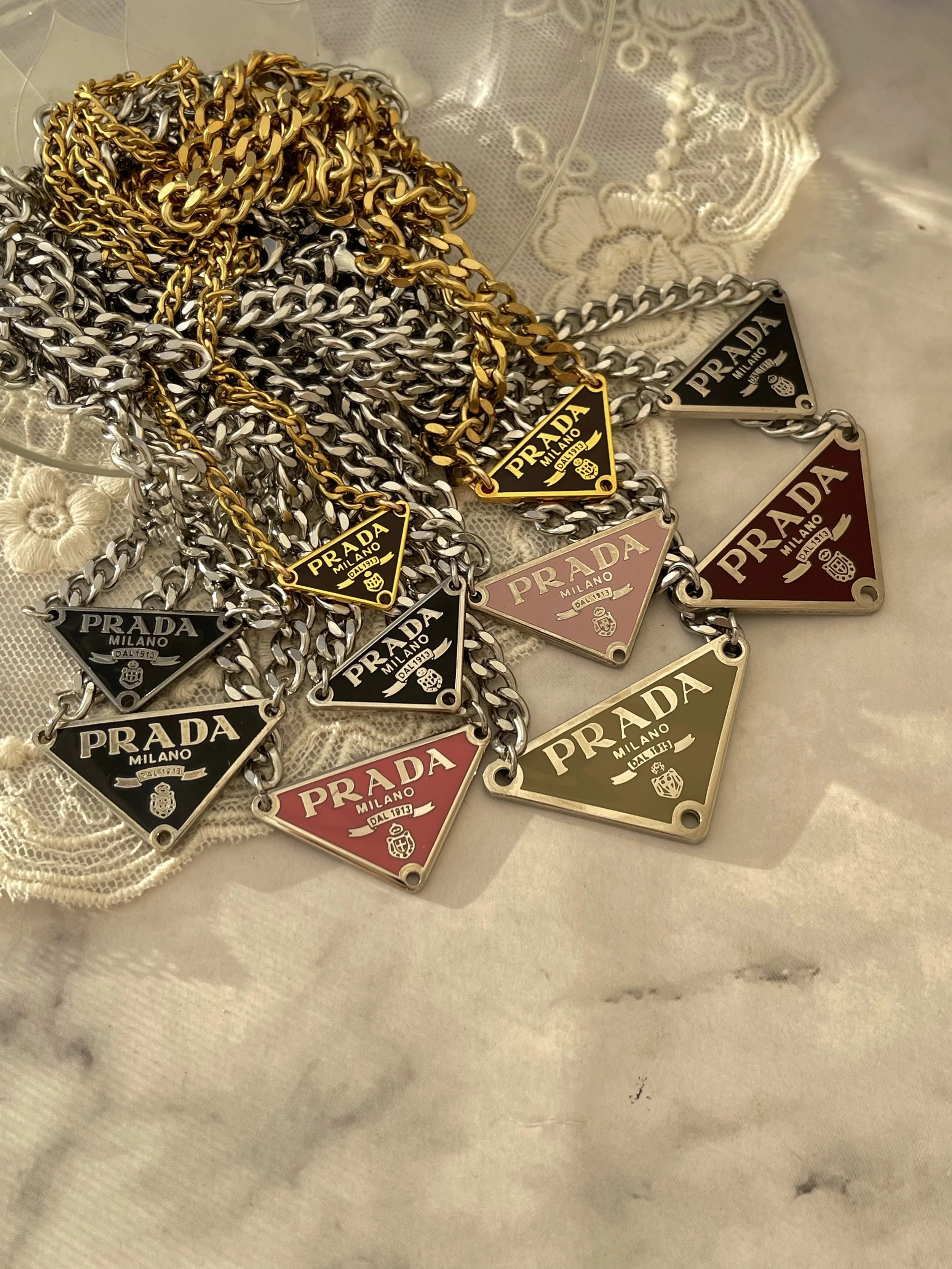 Prada Triangle Logo Collection — Shop — LUXE Reworked