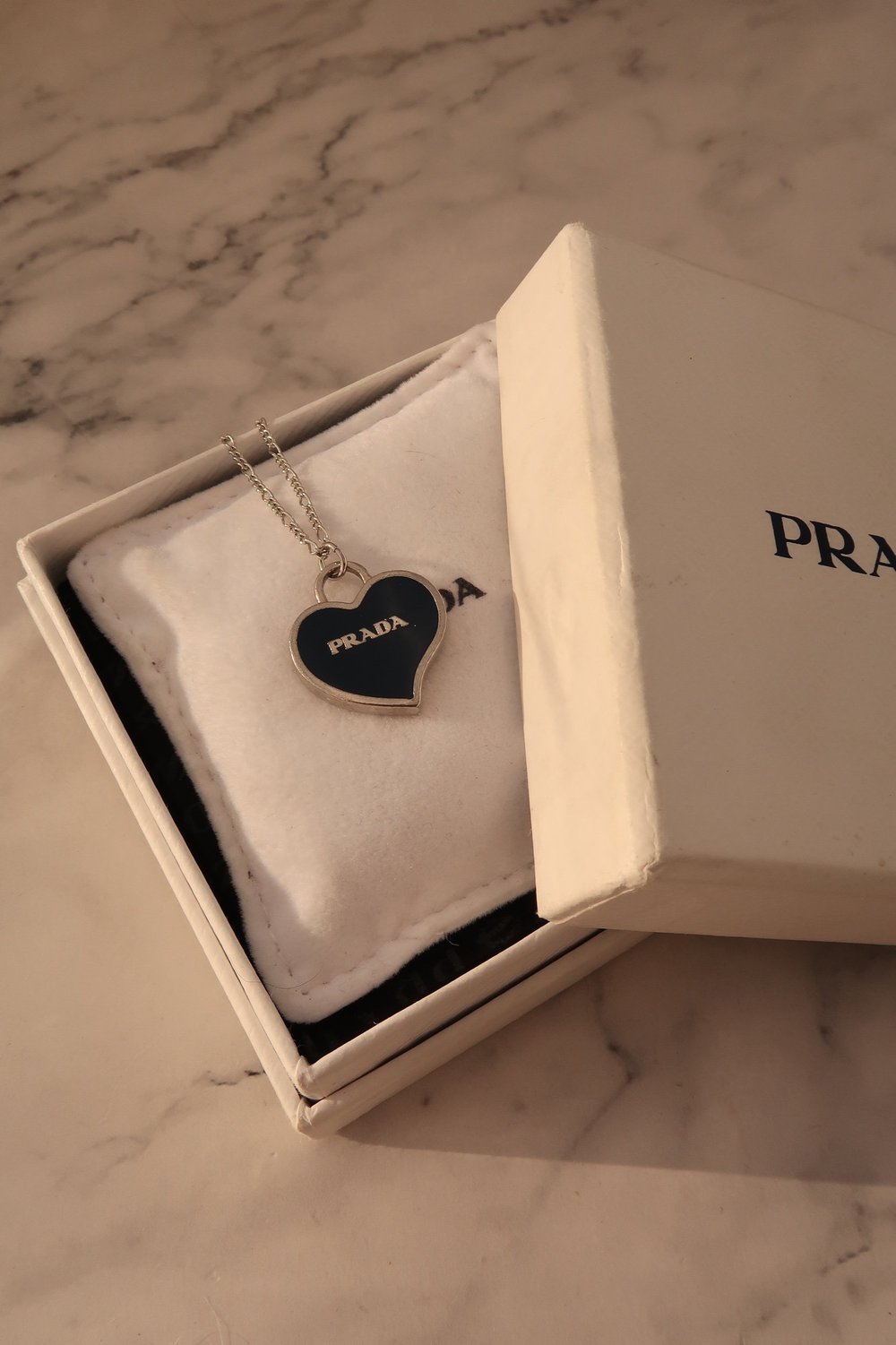 Prada Triangle Logo Collection — Shop — LUXE Reworked