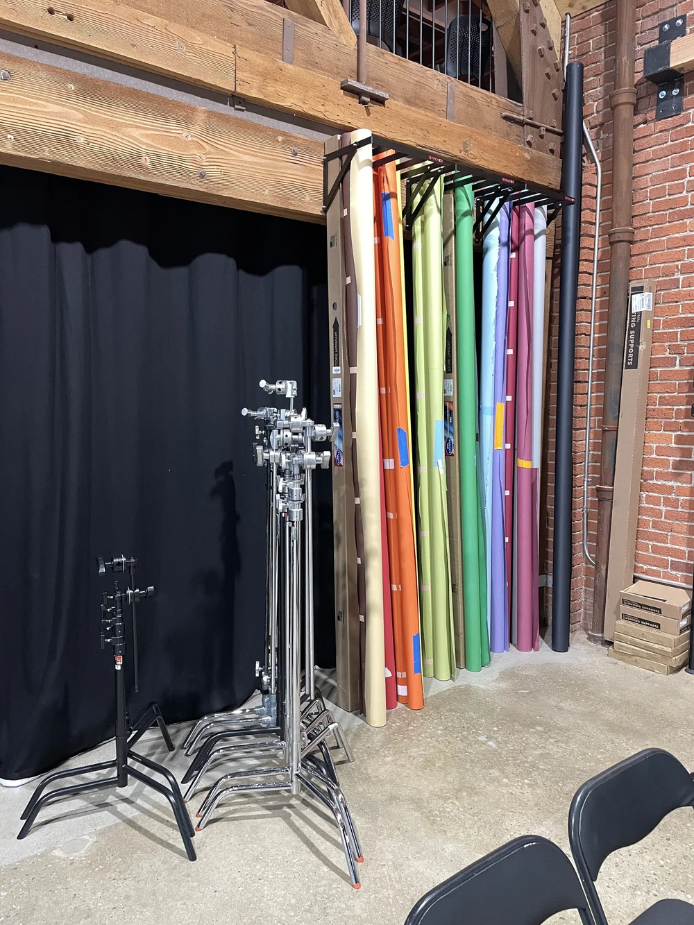 Stacker backdrop storage rack for photo studios