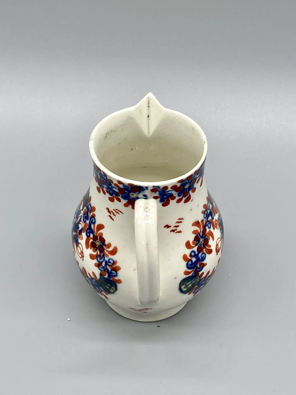 Early Worcester Porcelain Mask Jug, Parrot Pecking Fruit Pattern, circa ...
