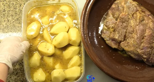 Greek Roasted Leg of Pork with Potatoes, Honey and Orange in a Clay pot ...