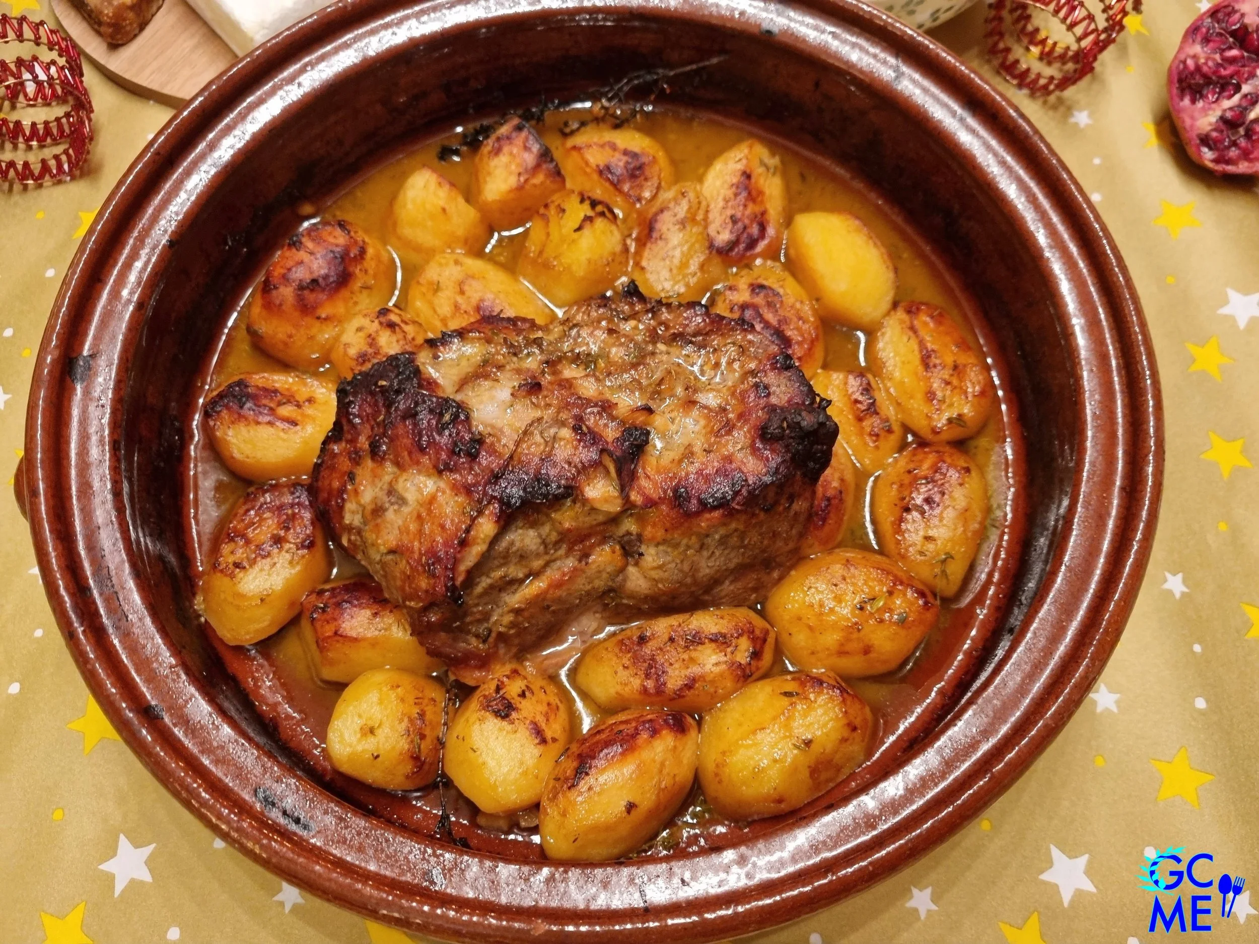 Greek Roasted Leg of Pork with Potatoes, Honey and Orange in a Clay pot ...