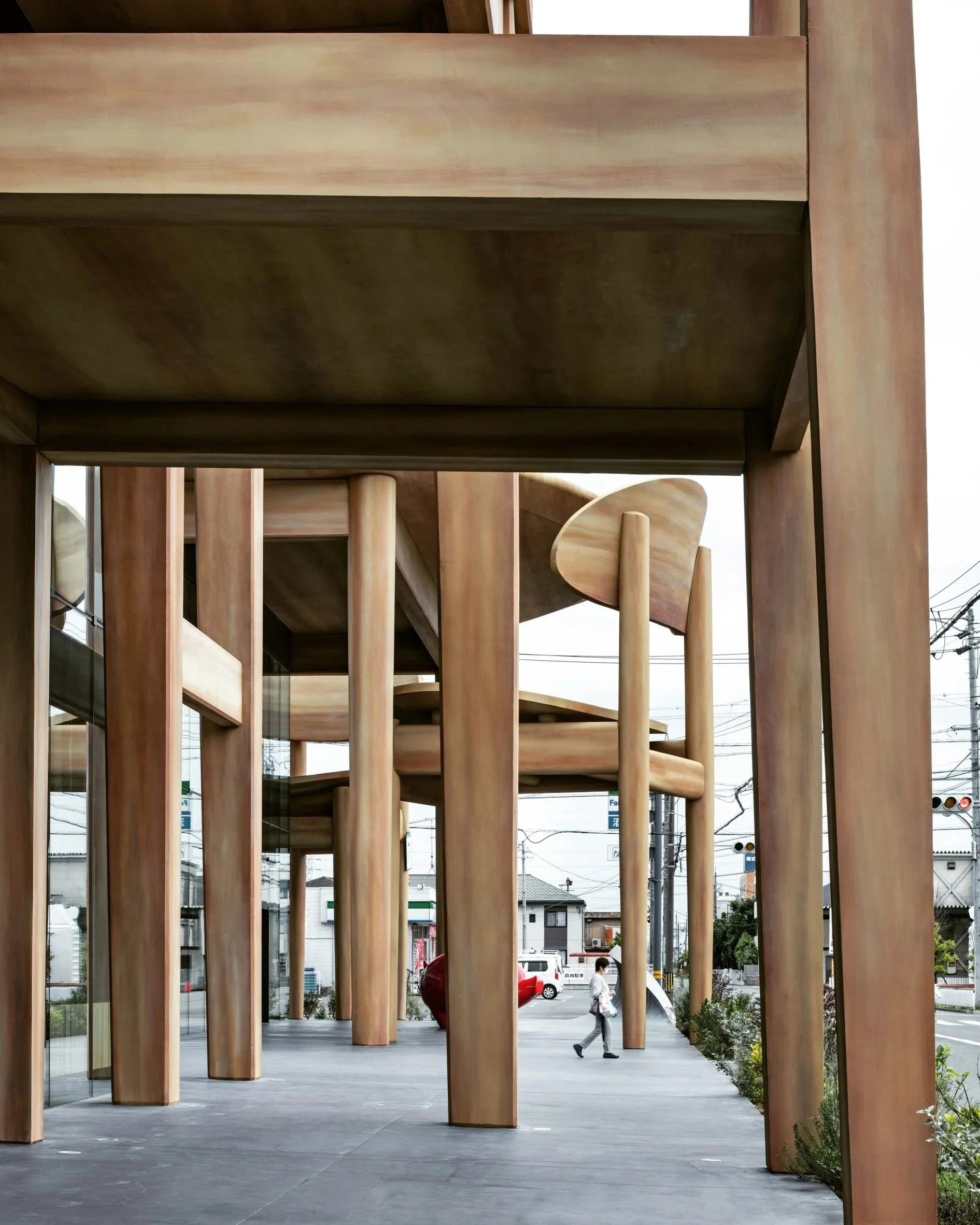 Nikken Sekkei shelters Japanese sweet company HQ with oversized table ...