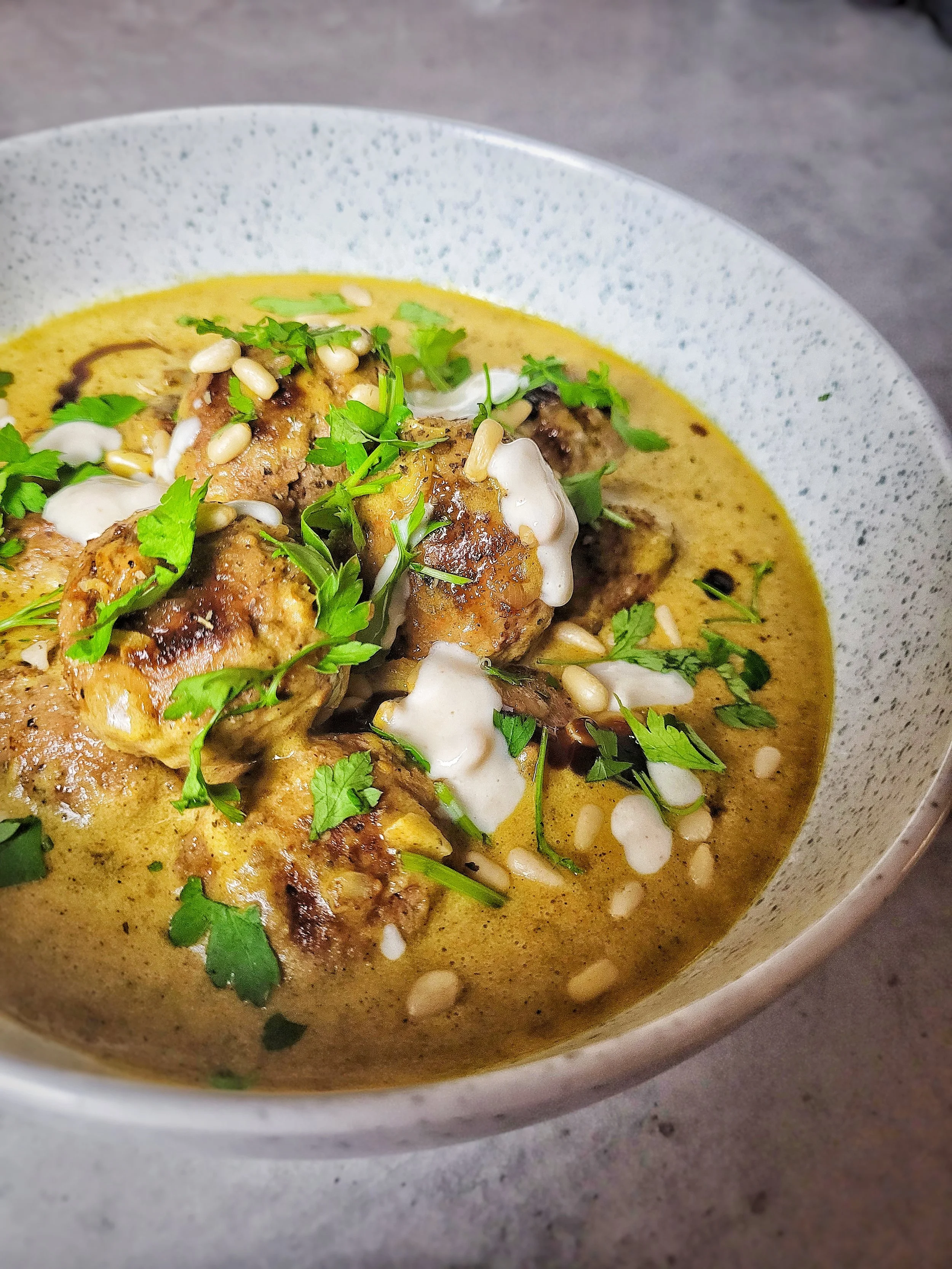 Middle eastern beef meatballs in a white bean spiced houmous sauce ...