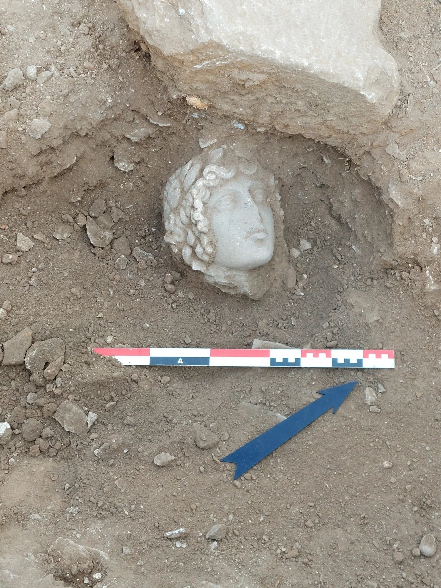 Marble Head of Apollo statue crowned with laurels unearthed