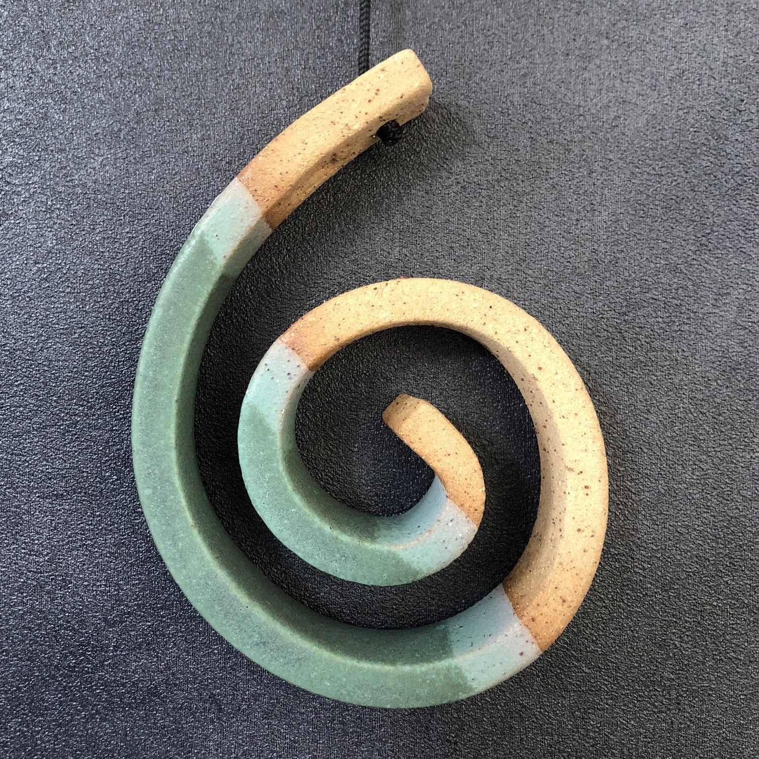 Koru Hanging — burnt sand pottery