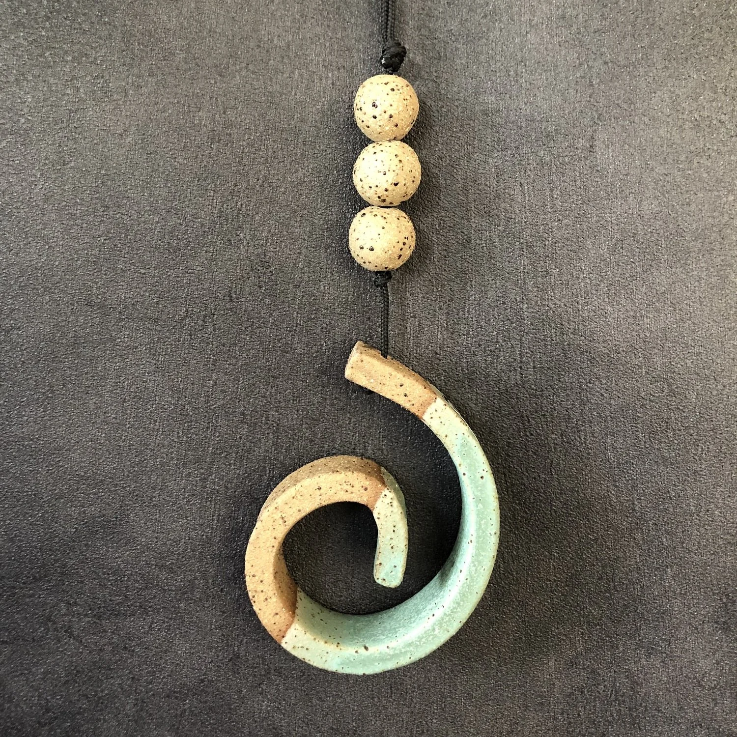 Koru Hanging — burnt sand pottery
