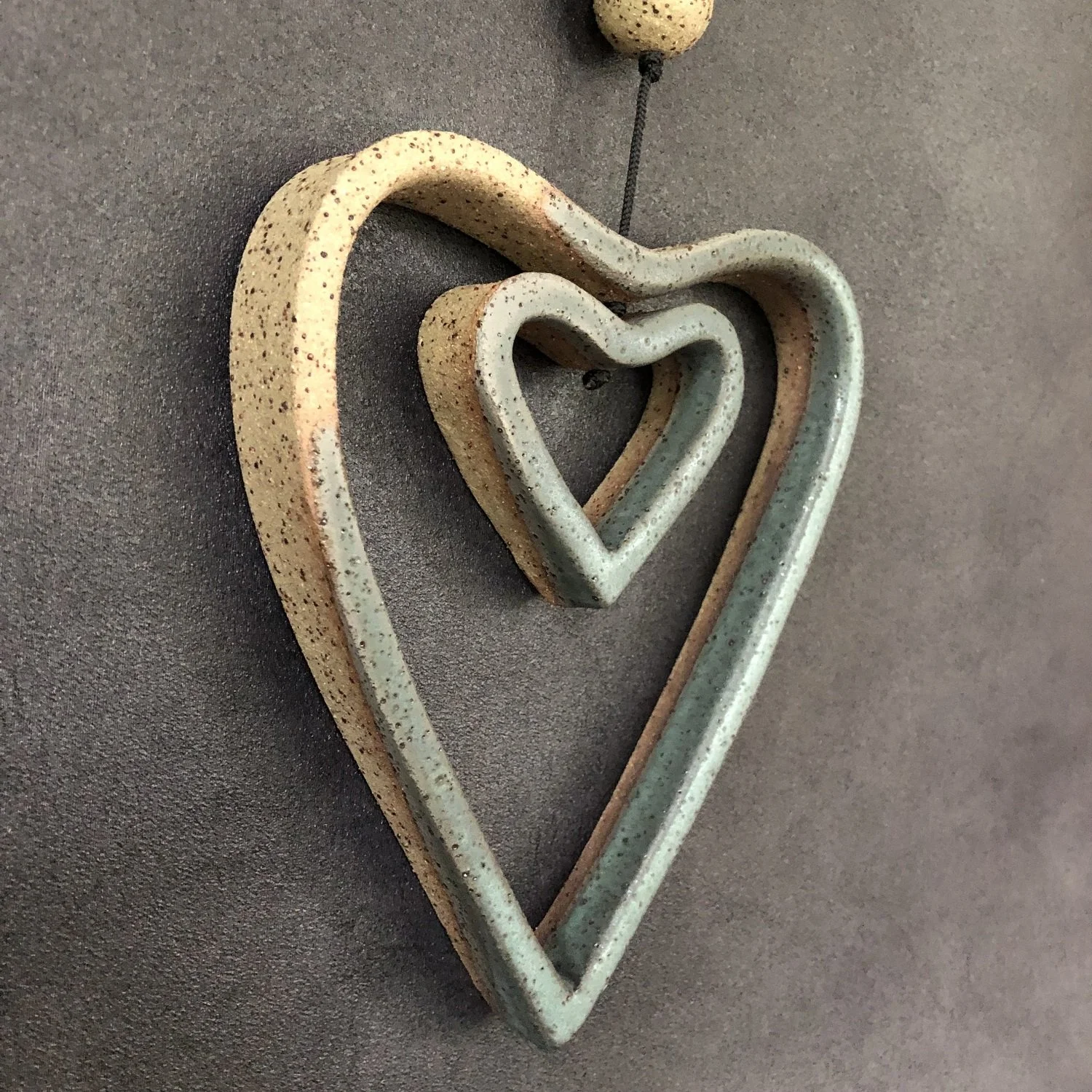 Hanging Hearts — burnt sand pottery