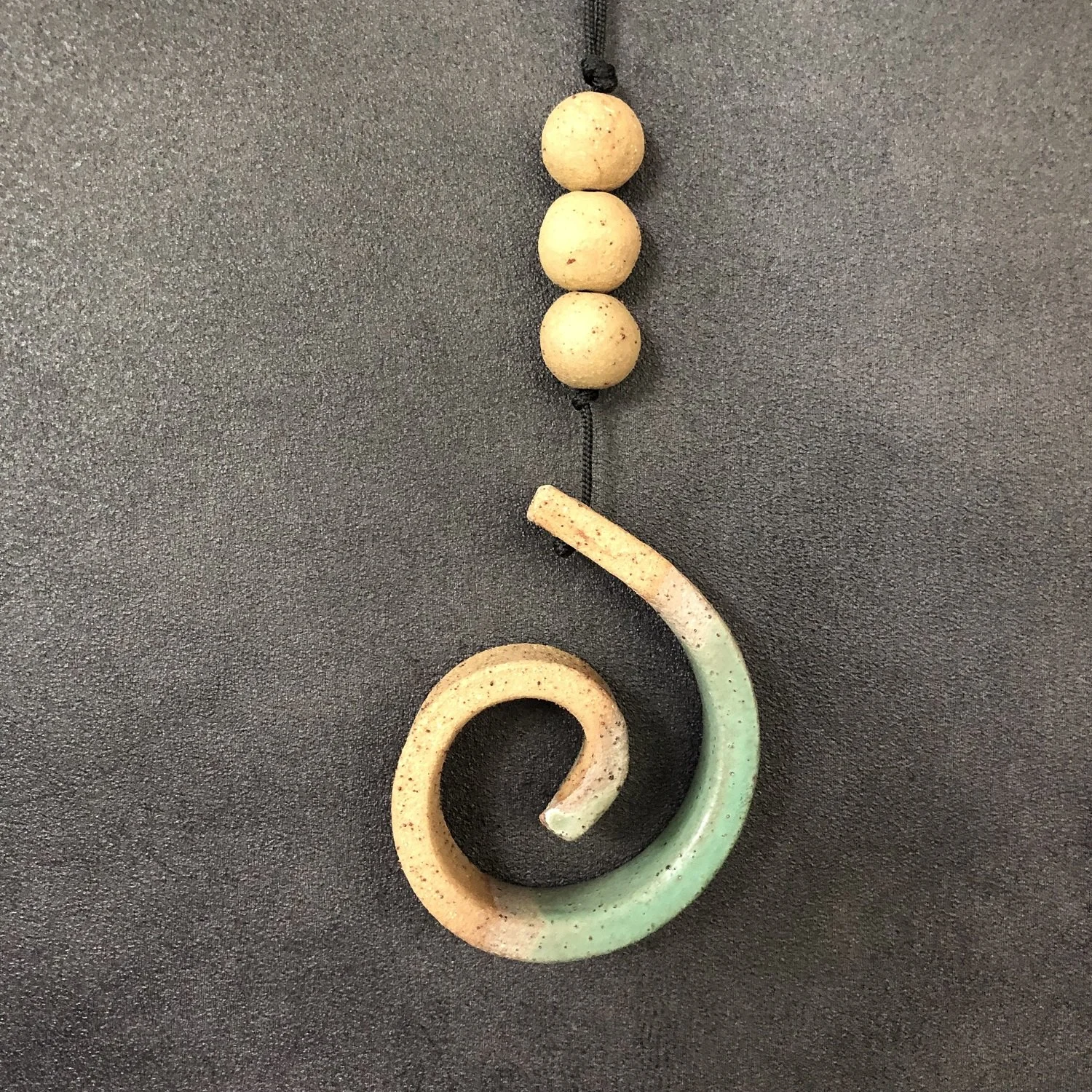 Koru Hanging — burnt sand pottery