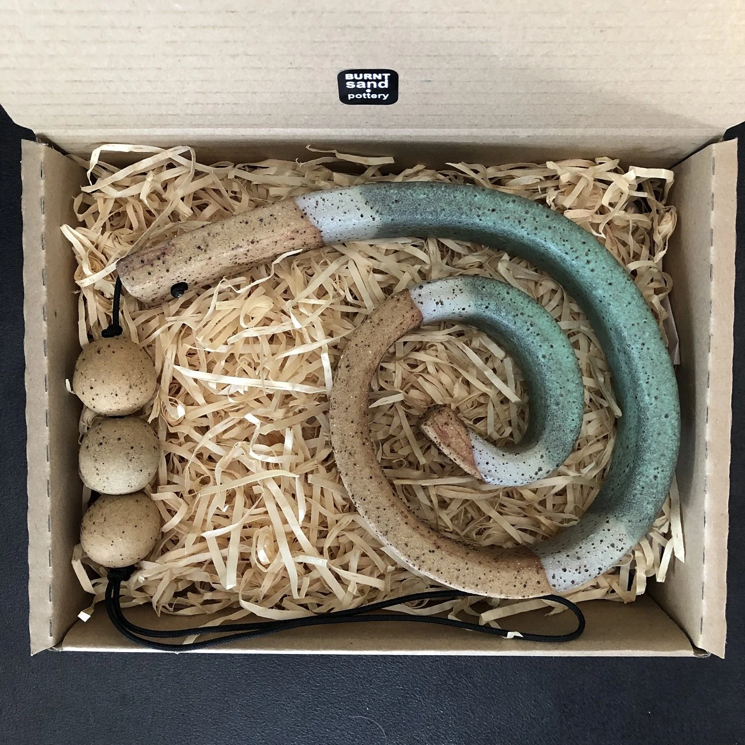 large . koru . hanging — burnt sand pottery