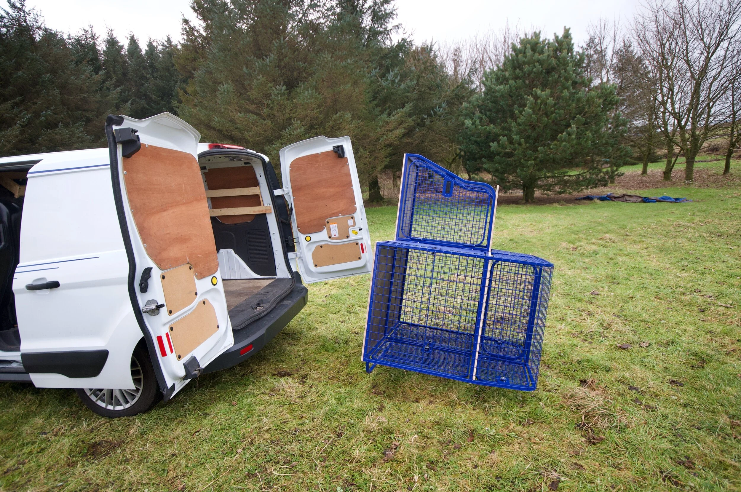 Cages made for a dog walker in a transit connect — Barras Blades