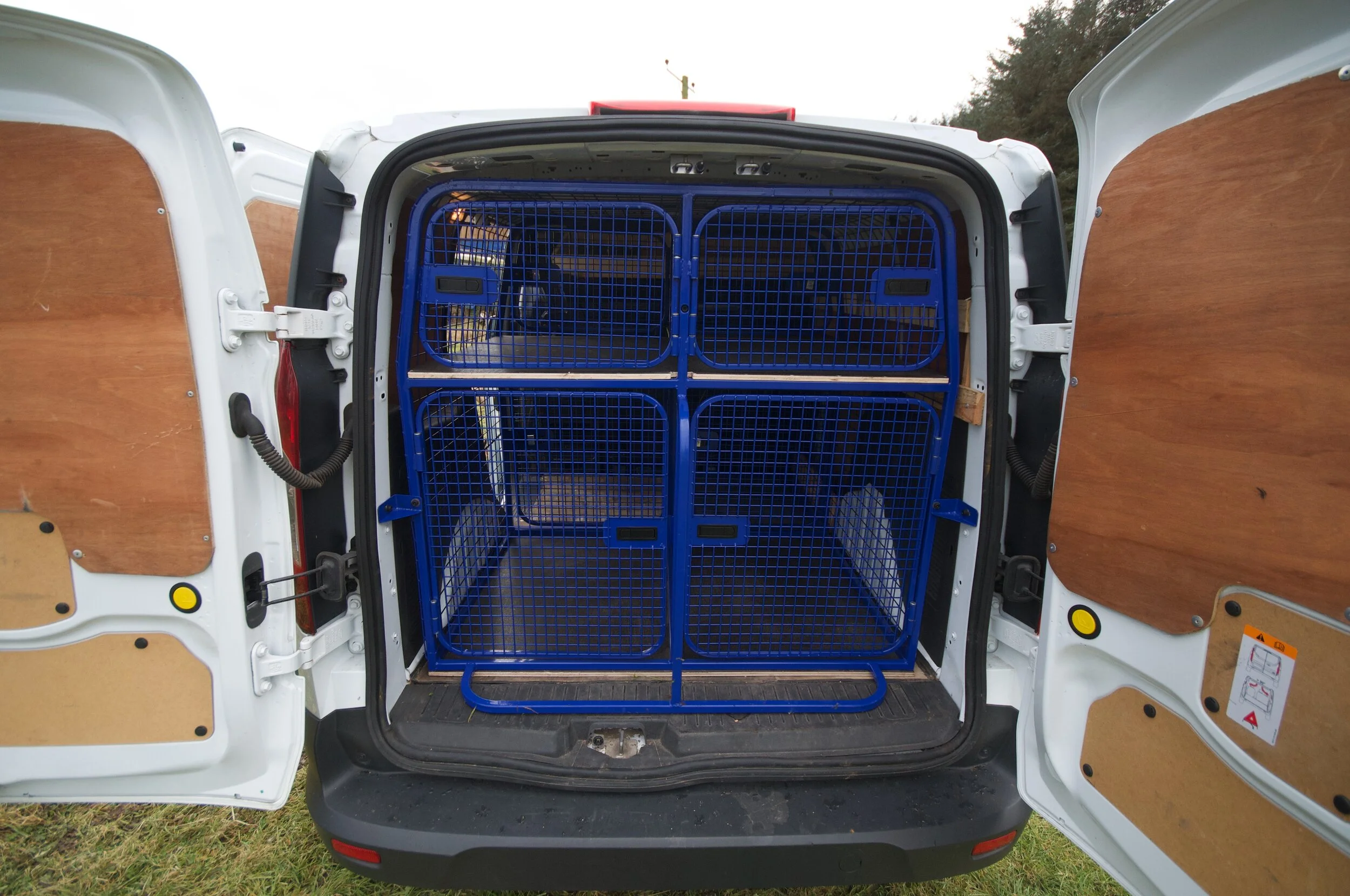 Cages made for a dog walker in a transit connect — Barras Blades